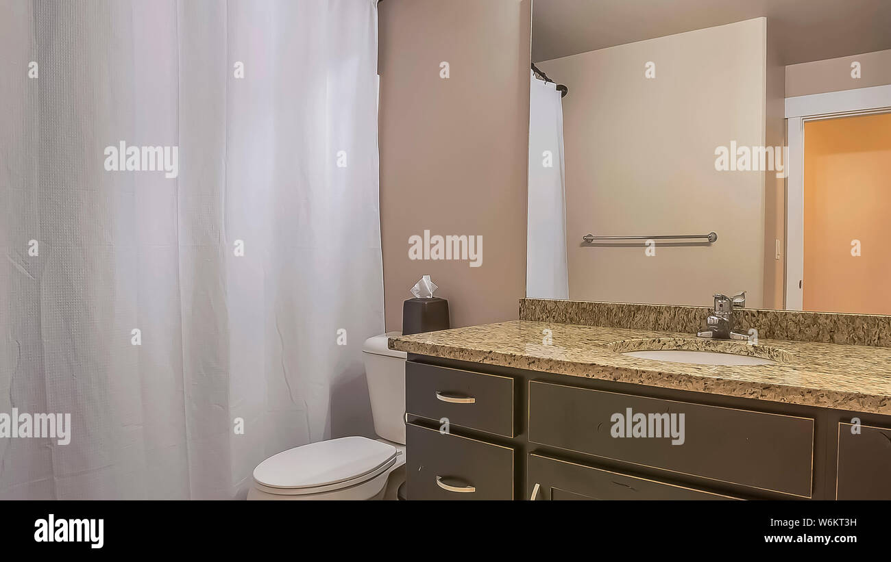 Panorama Vanity unit toilet and towel hook against the white wall of a ...