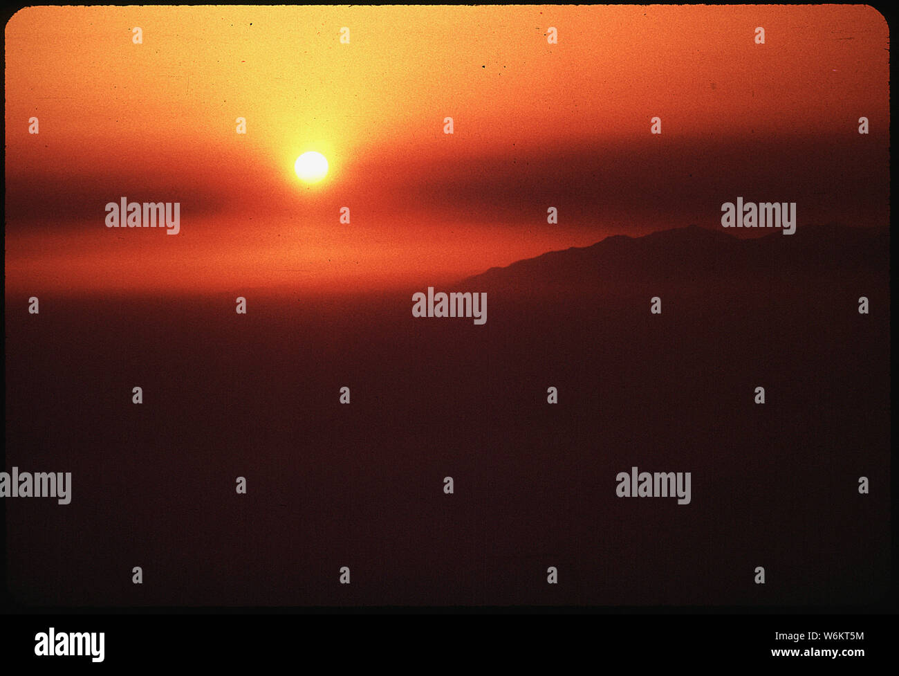 SUNSET SEEN THROUGH SMOG Stock Photo - Alamy