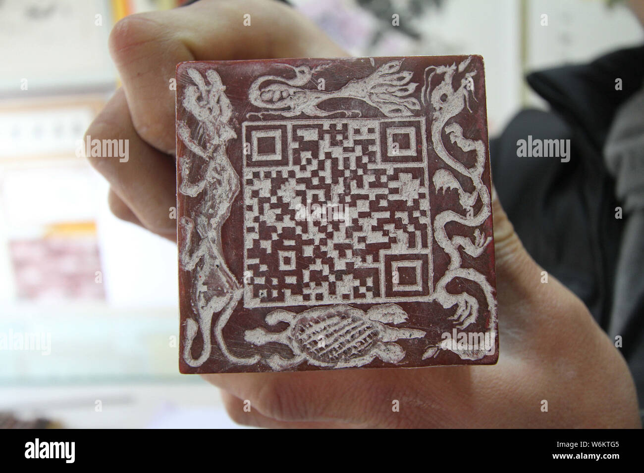 Chinese young man Cao Yewei shows his QR code seal in Handan city ...