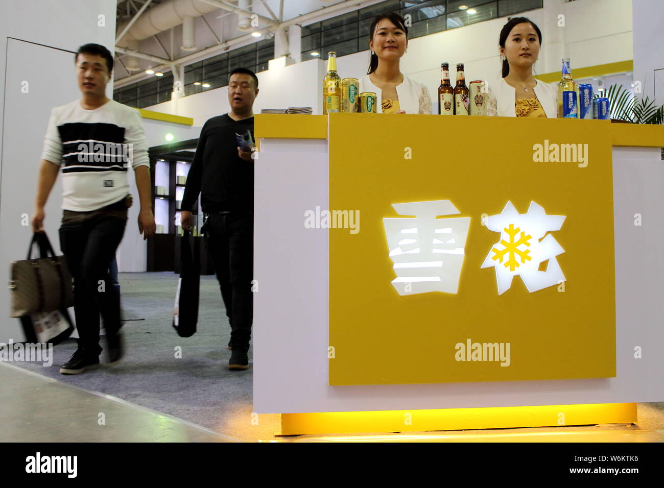 --FILE--People visit the stand of Snow beer of China Resources Snow ...