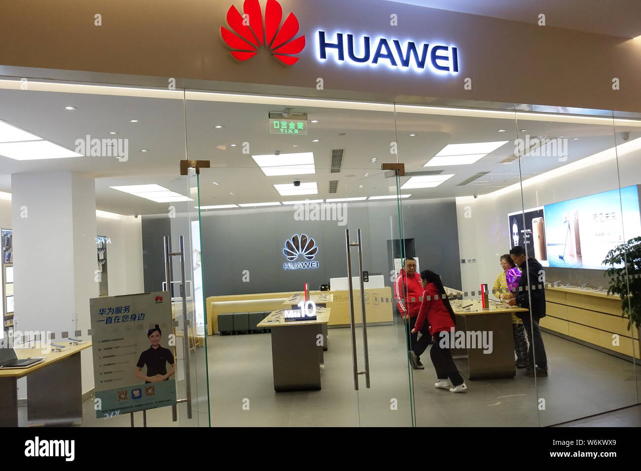 --FILE--Chinese employees are seen at a store of Huawei in Shanghai ...