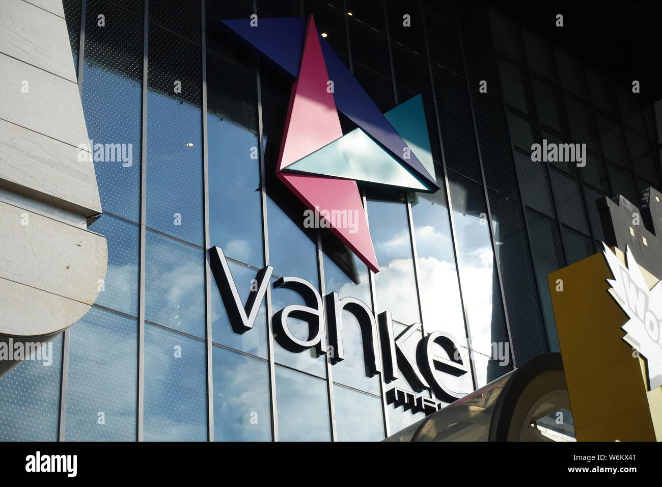--FILE--A logo of Vanke is pictured at the Vanke shopping mall in ...