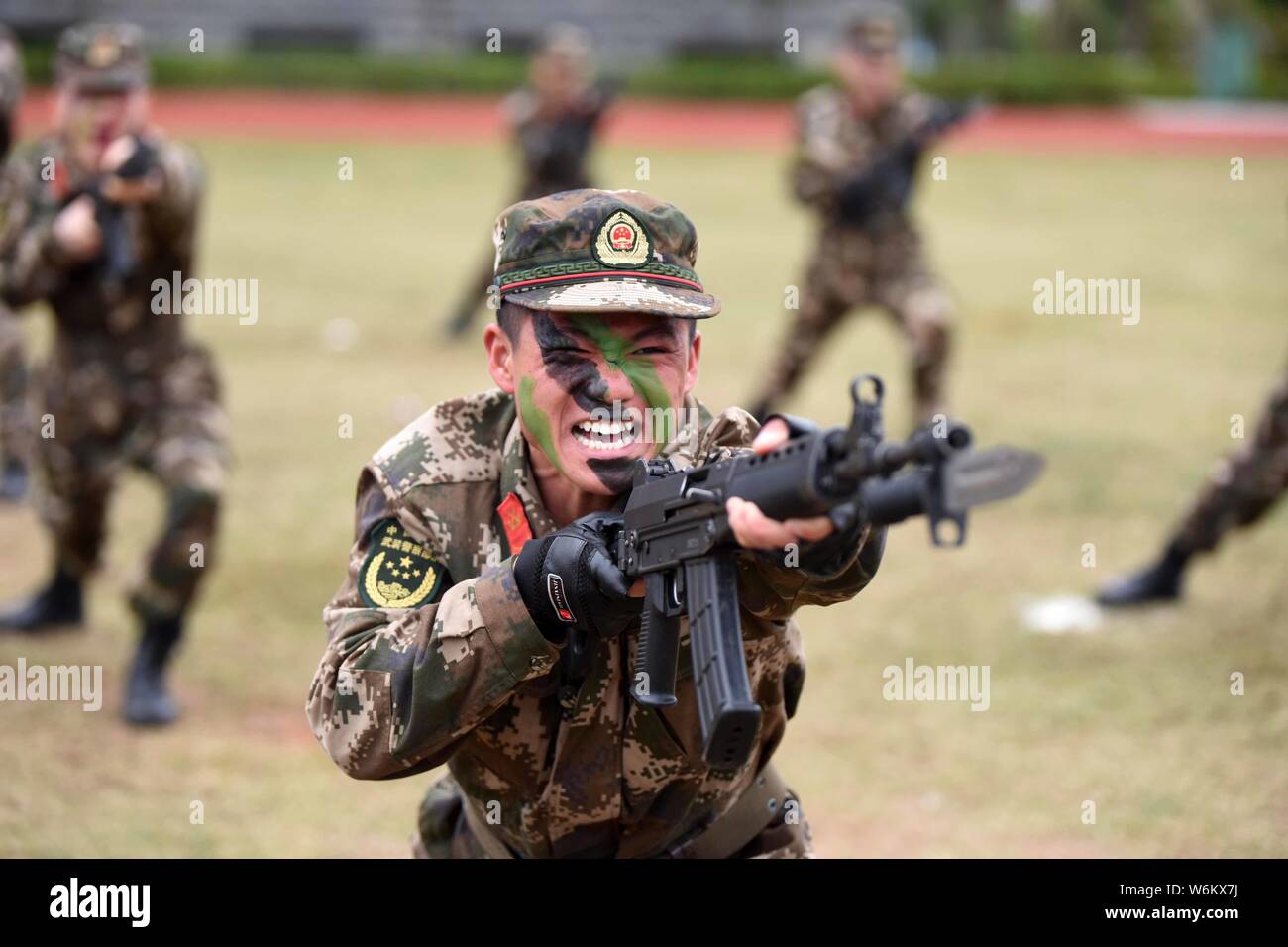 Chinese paramilitary policemen take part in a military training in ...
