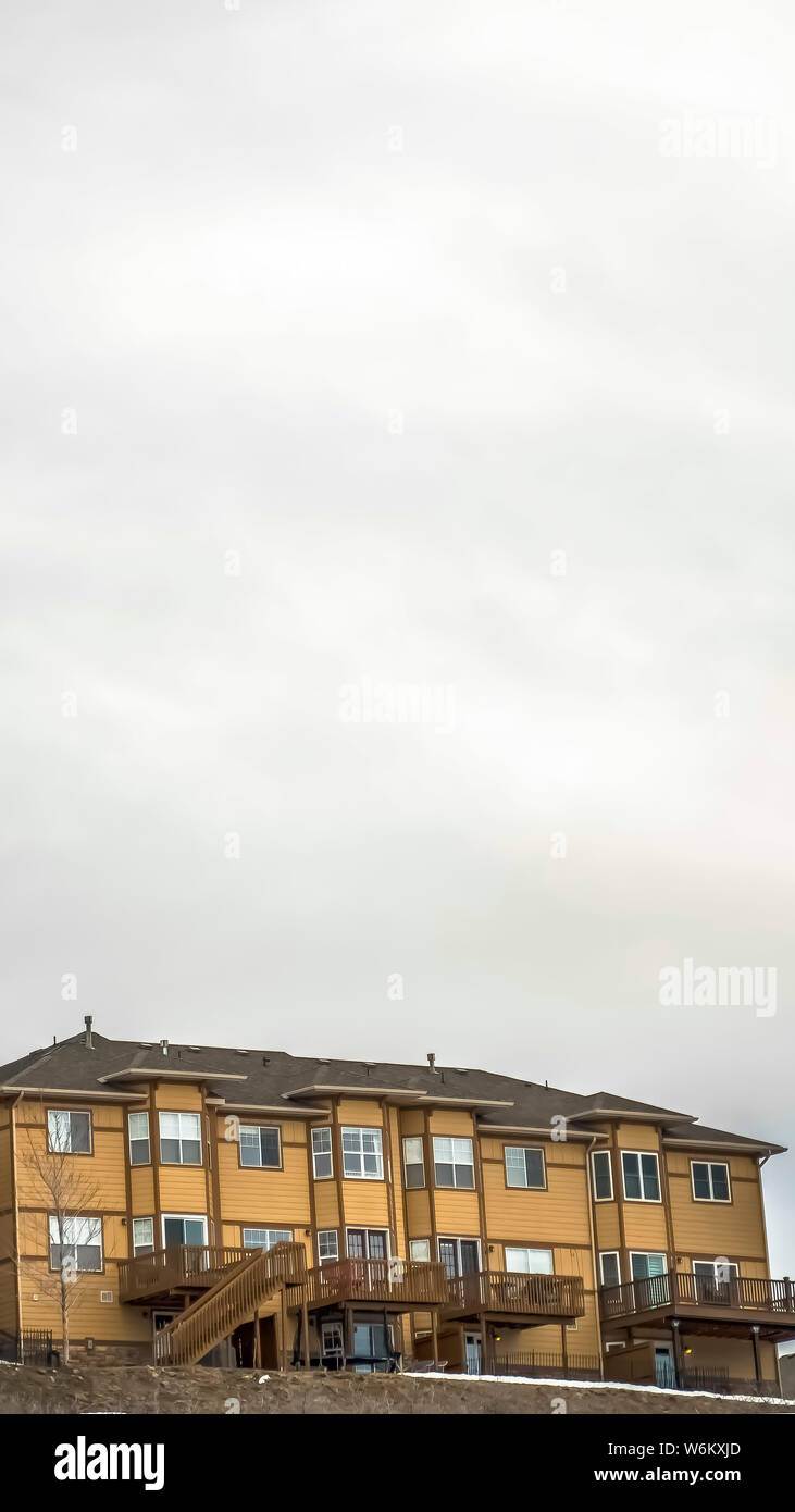 Vertical frame Homes with balconies and half hexagon shaped windows ...