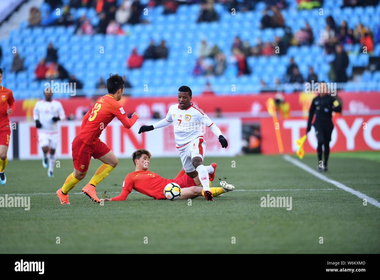 Al Mandhar Rabia Said Al Alawi of Oman, right, kicks the ball to make a ...
