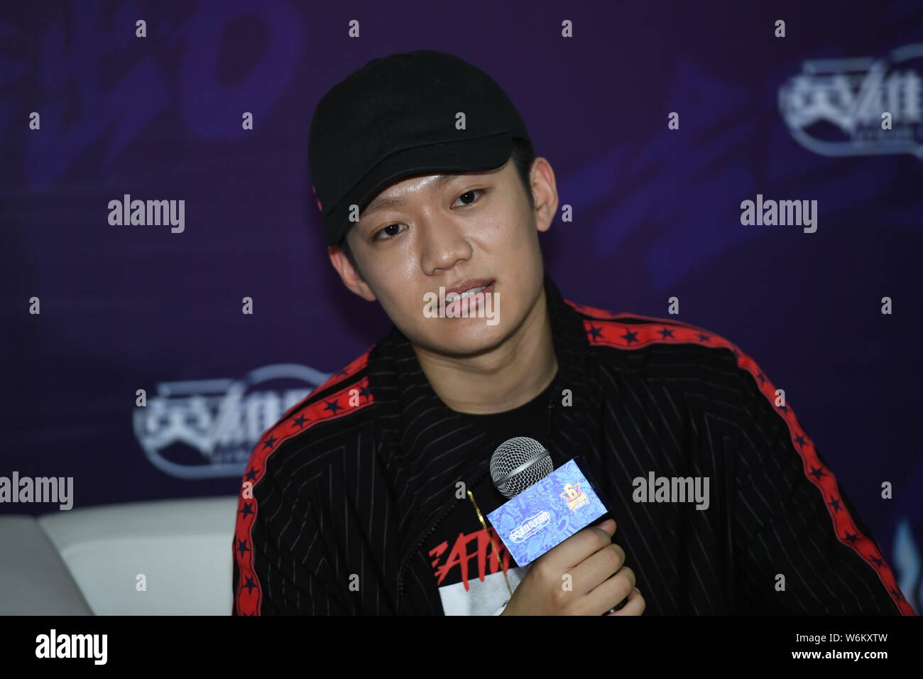 --FILE--Chinese rapper Wang Hao, better known as PG One, reacts during ...
