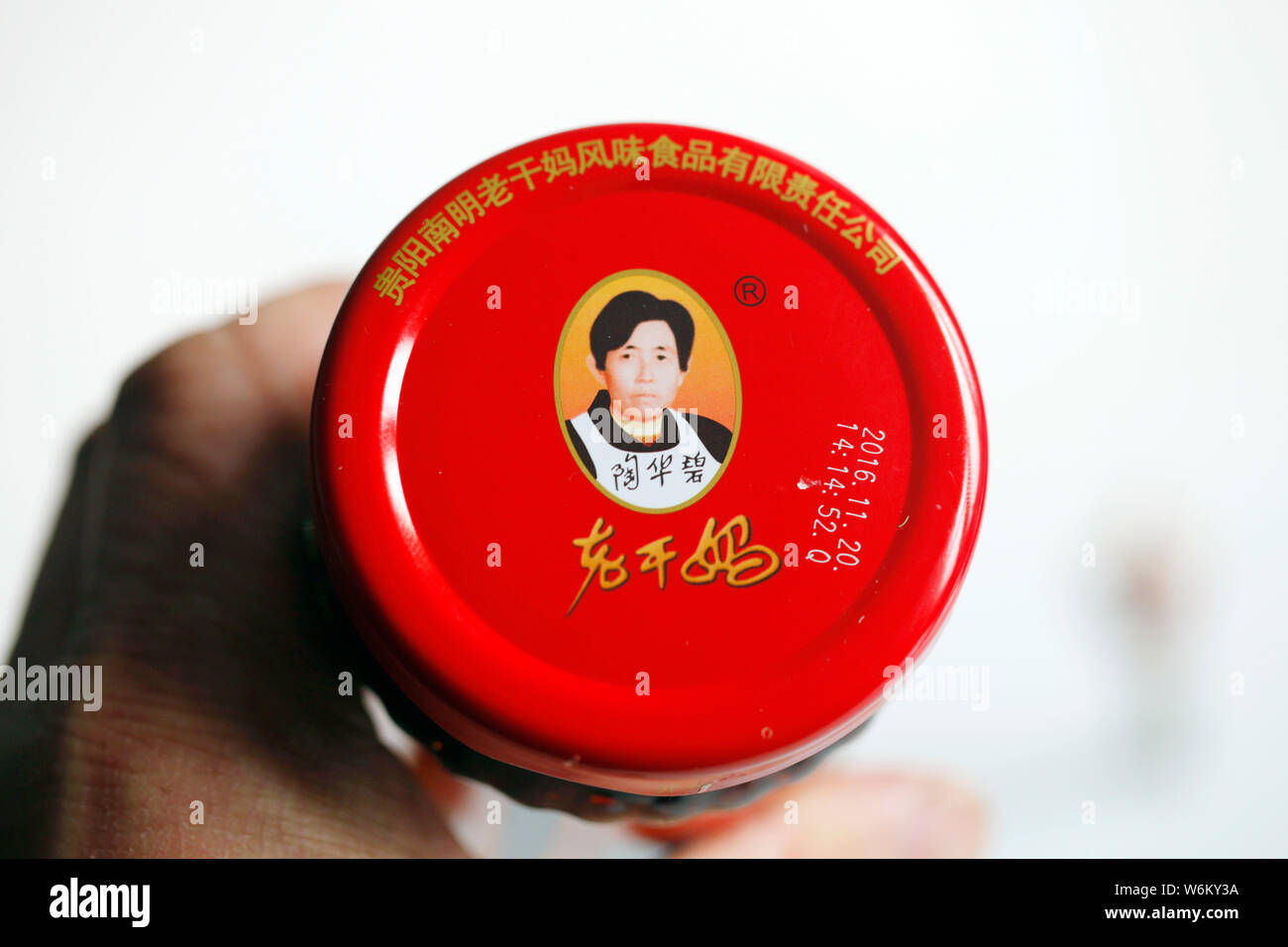 --FILE--A Chinese shopper buys a bottle of Lao Gan Ma or Laoganma chili ...