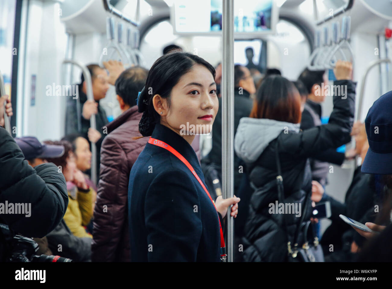 Passengers crowd to an "Optics Valley Quantum" tram during the trial ...