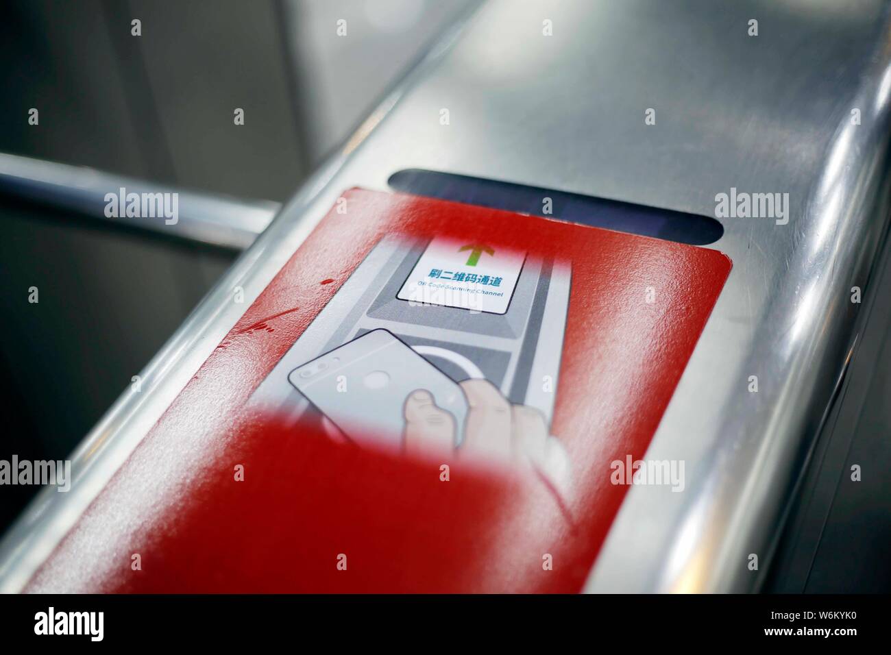 View of a sign on a turnstile to let passengers have the QR codes on ...