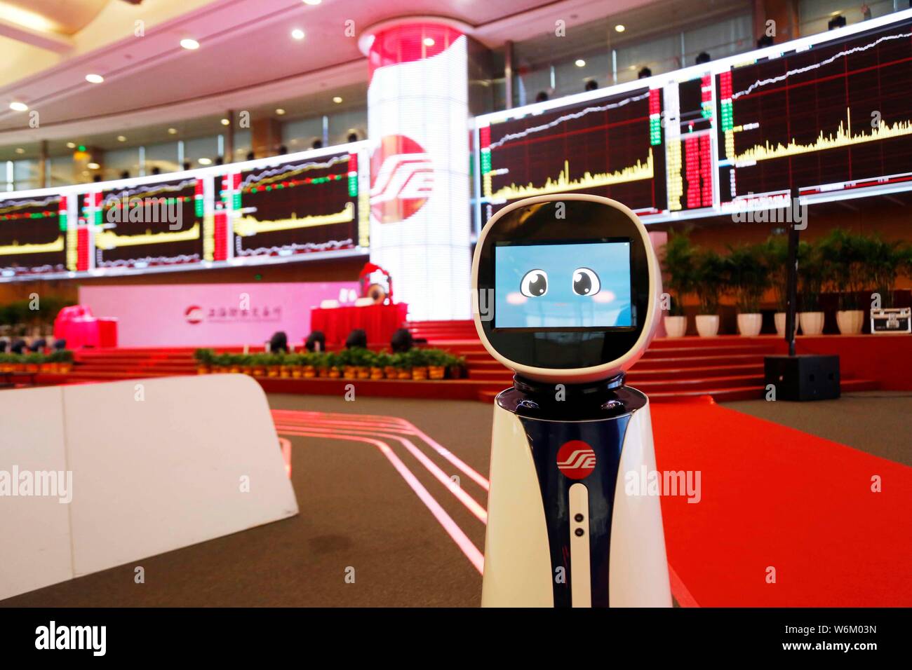 The artificial intelligent (AI) robot Zhen Zhen serves visitors at the ...
