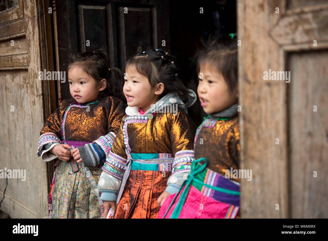 Children of Dong ethnic minority dressed in traditional clothes sing ...