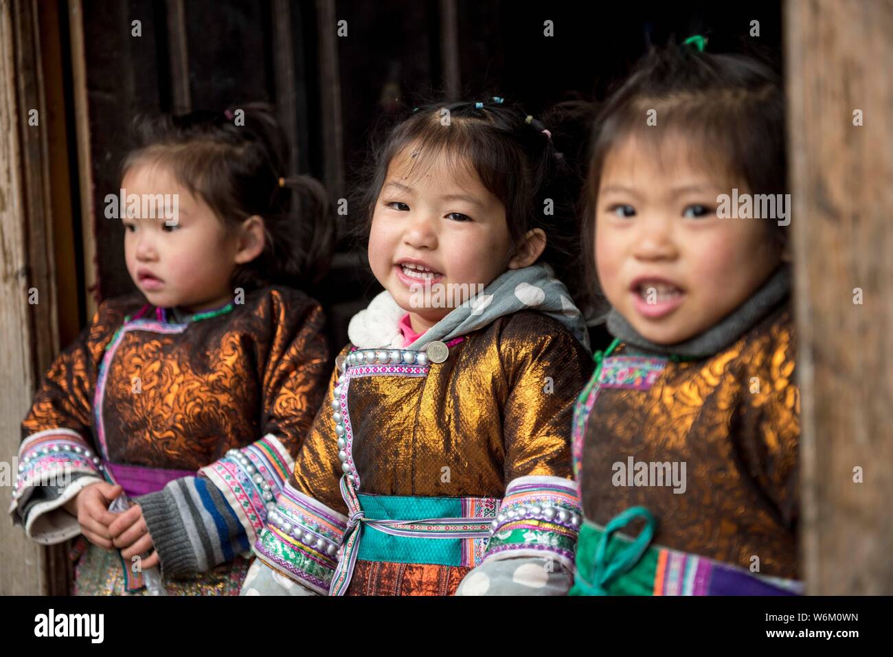 Children of Dong ethnic minority dressed in traditional clothes sing ...