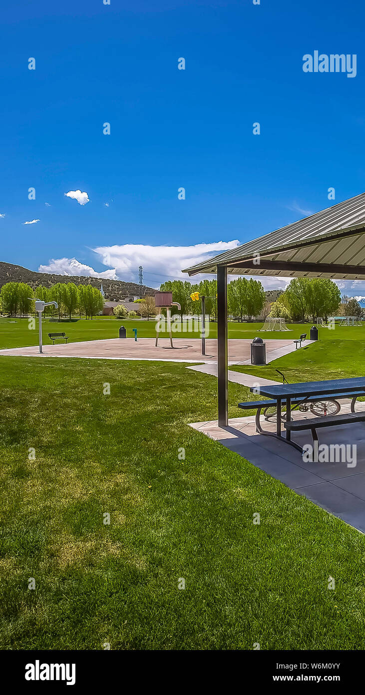 Vertical frame Picnic pavilion with a pathway connected to a water park ...