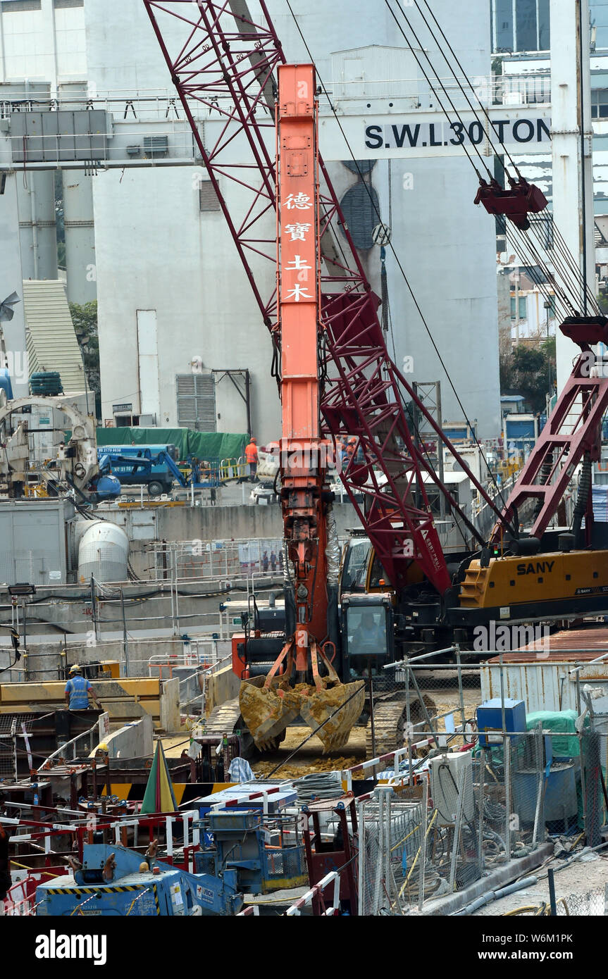A crane operates at an MTR Corporation's construction site of Sha Tin ...