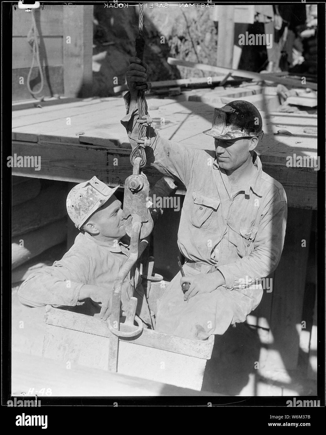 Shaftmen at the mouth of the vertical test shaft for examination of ...