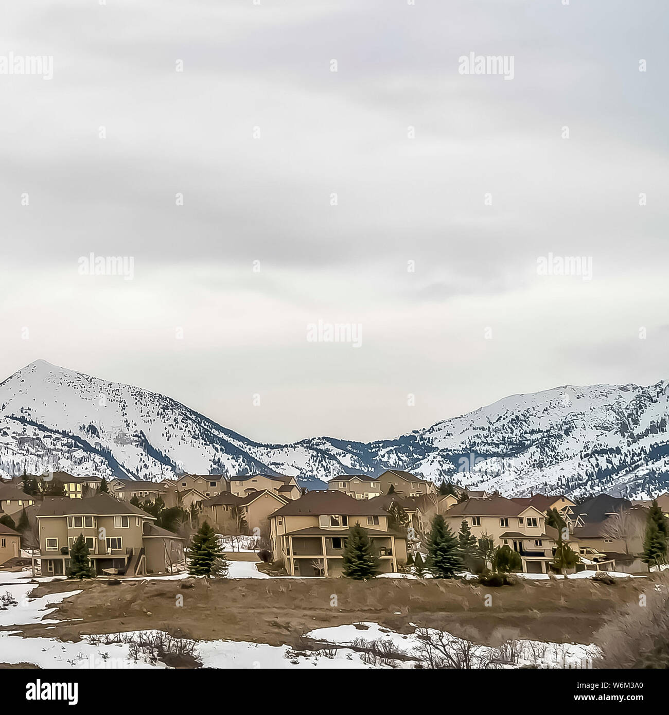 Square Scenic winter landscape with cloudy sky over striking mountain ...