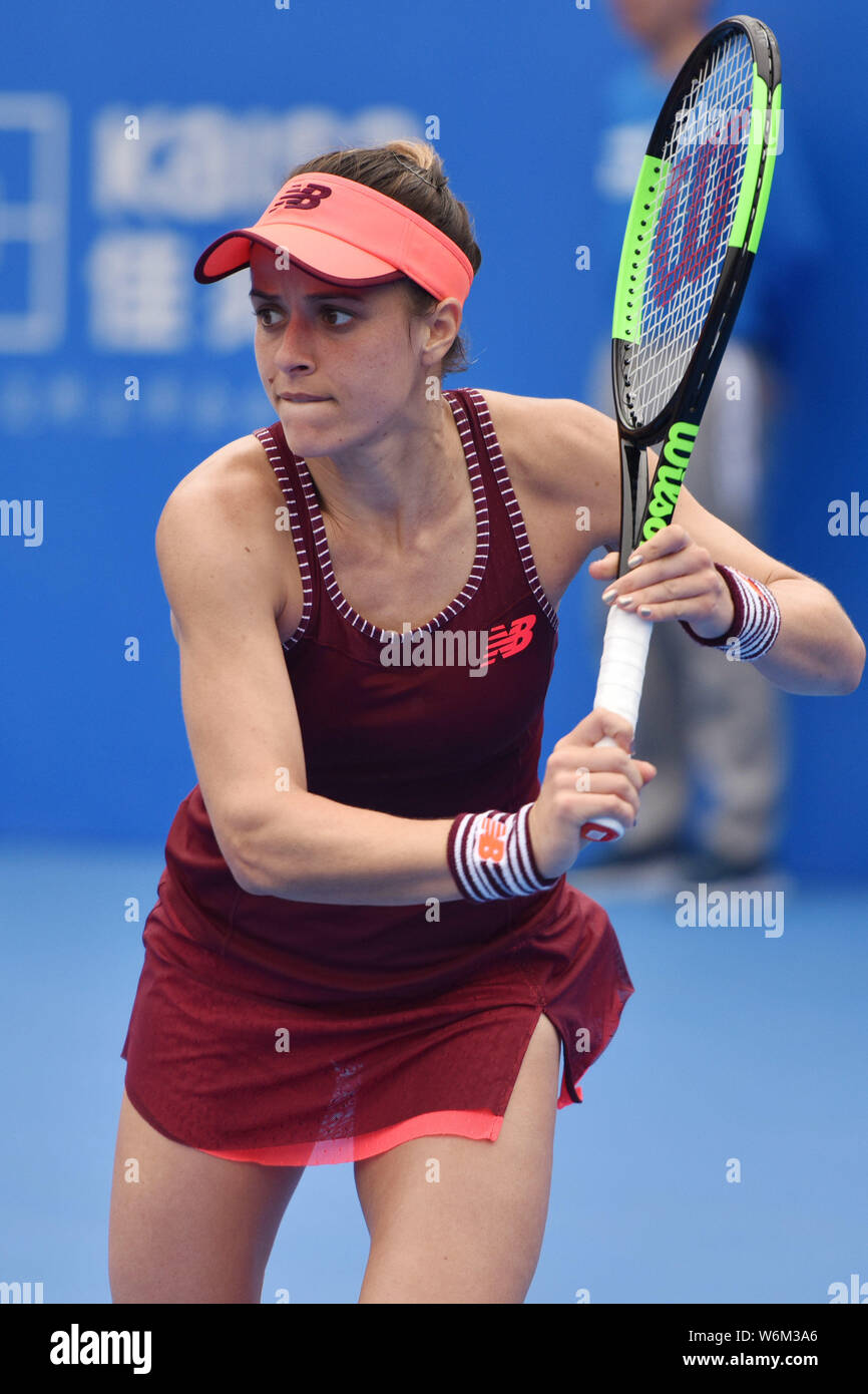 Nicole Gibbs of the United States returns a shot to Simona Halep of ...