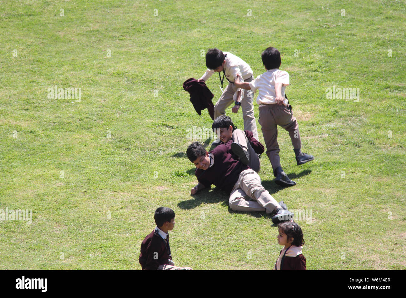 School children playing in playground Stock Photo - Alamy