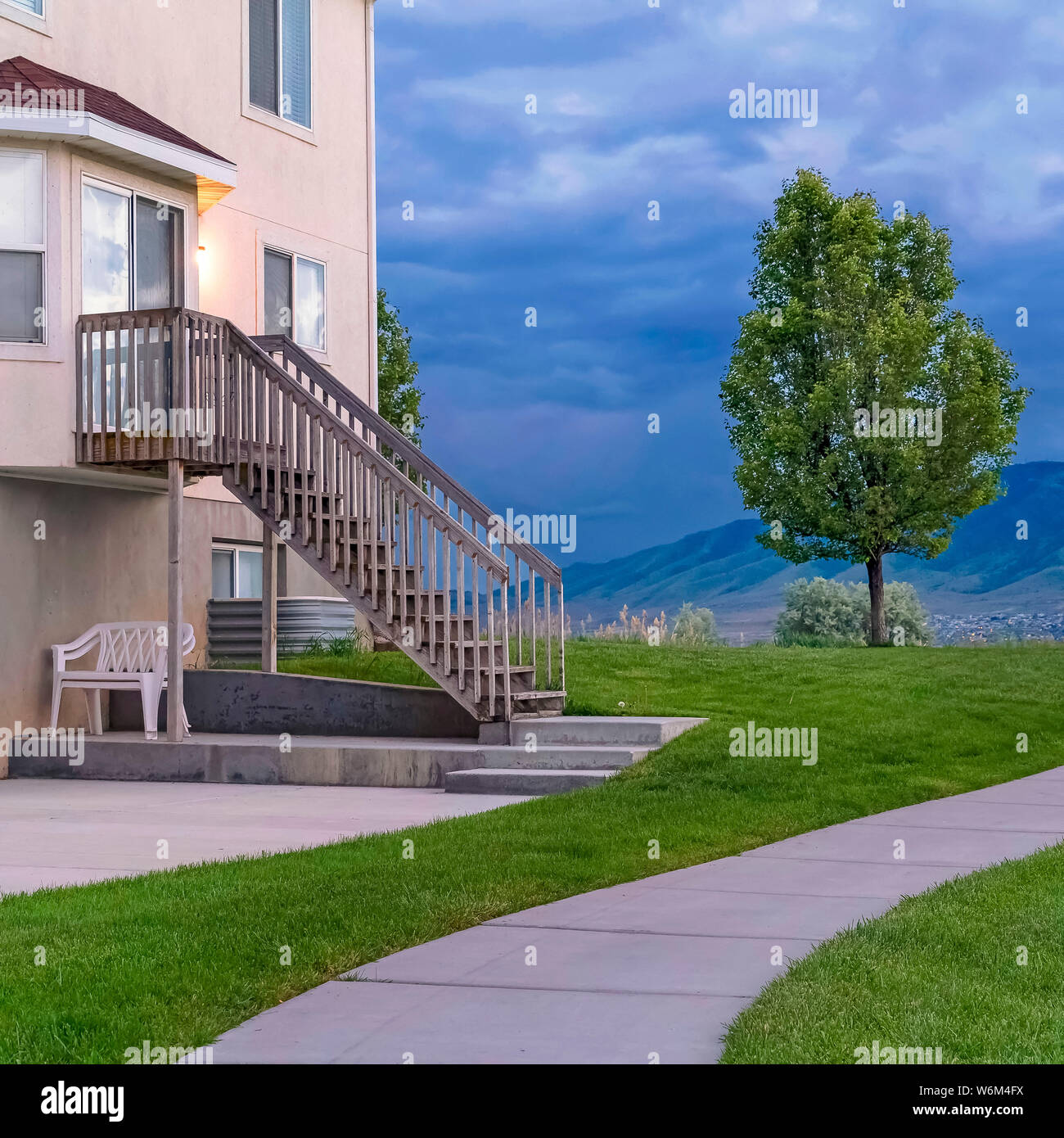 Square frame Pathway in front of a home with stairs leading to the ...