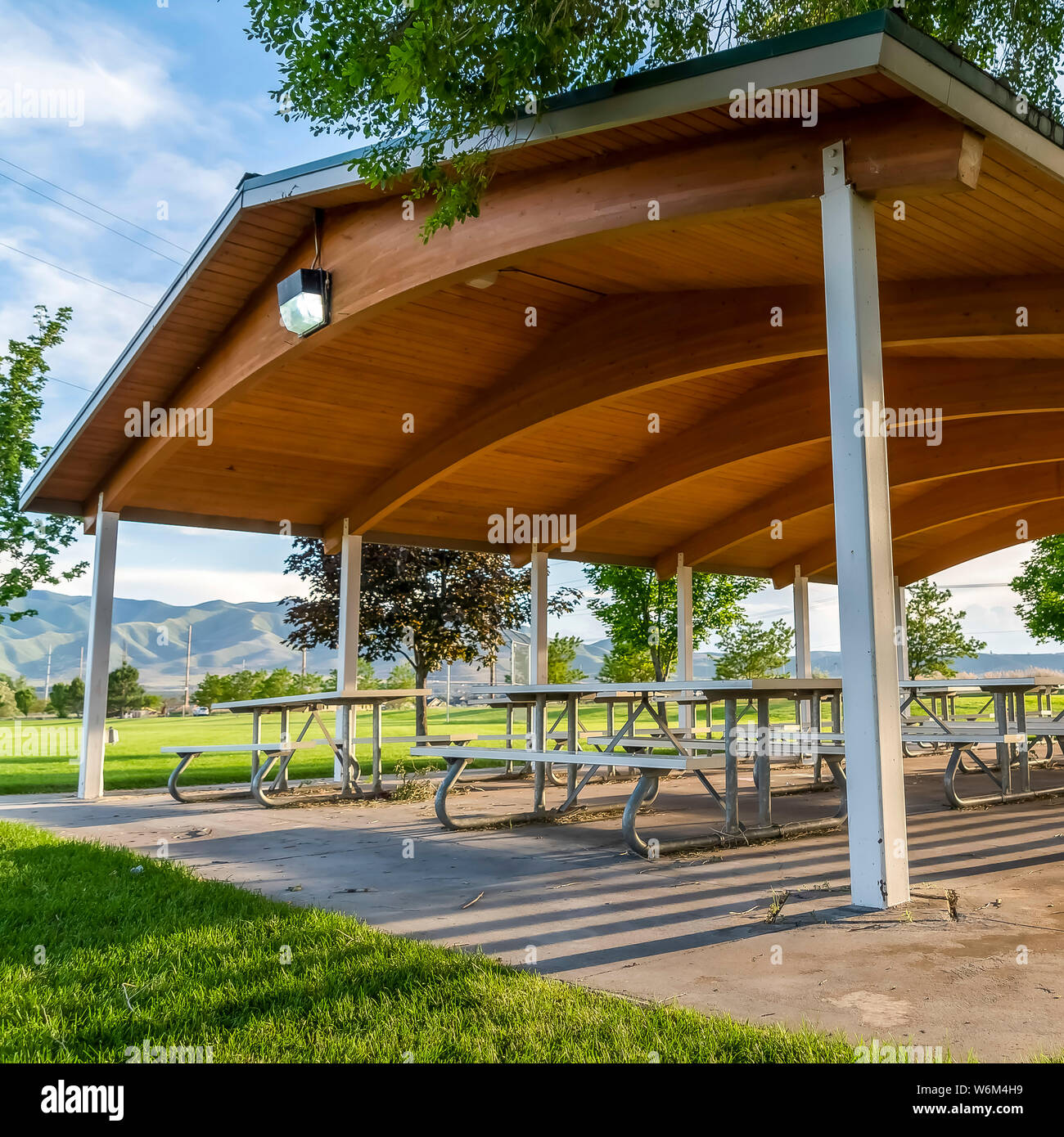 Square frame Picnic tables and benches under a pavilion on a scenic ...
