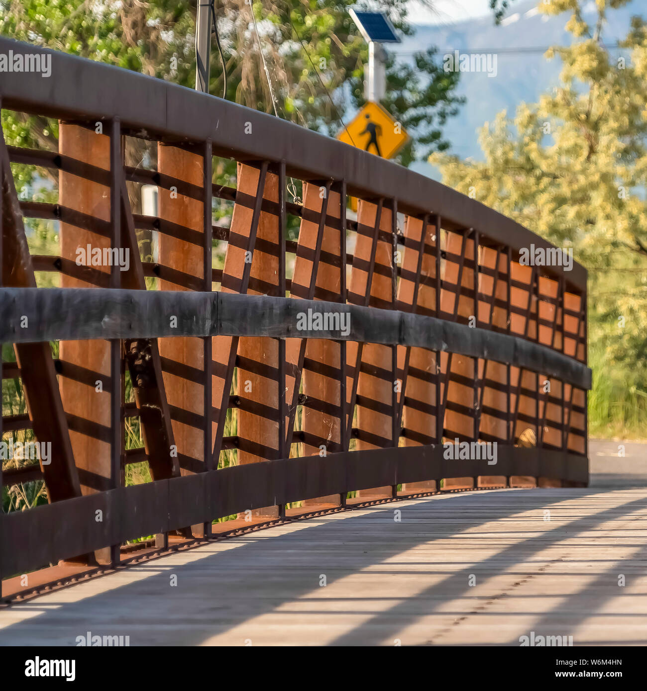 Square frame Close up of a bridge with metal guardrail and wood deck on ...