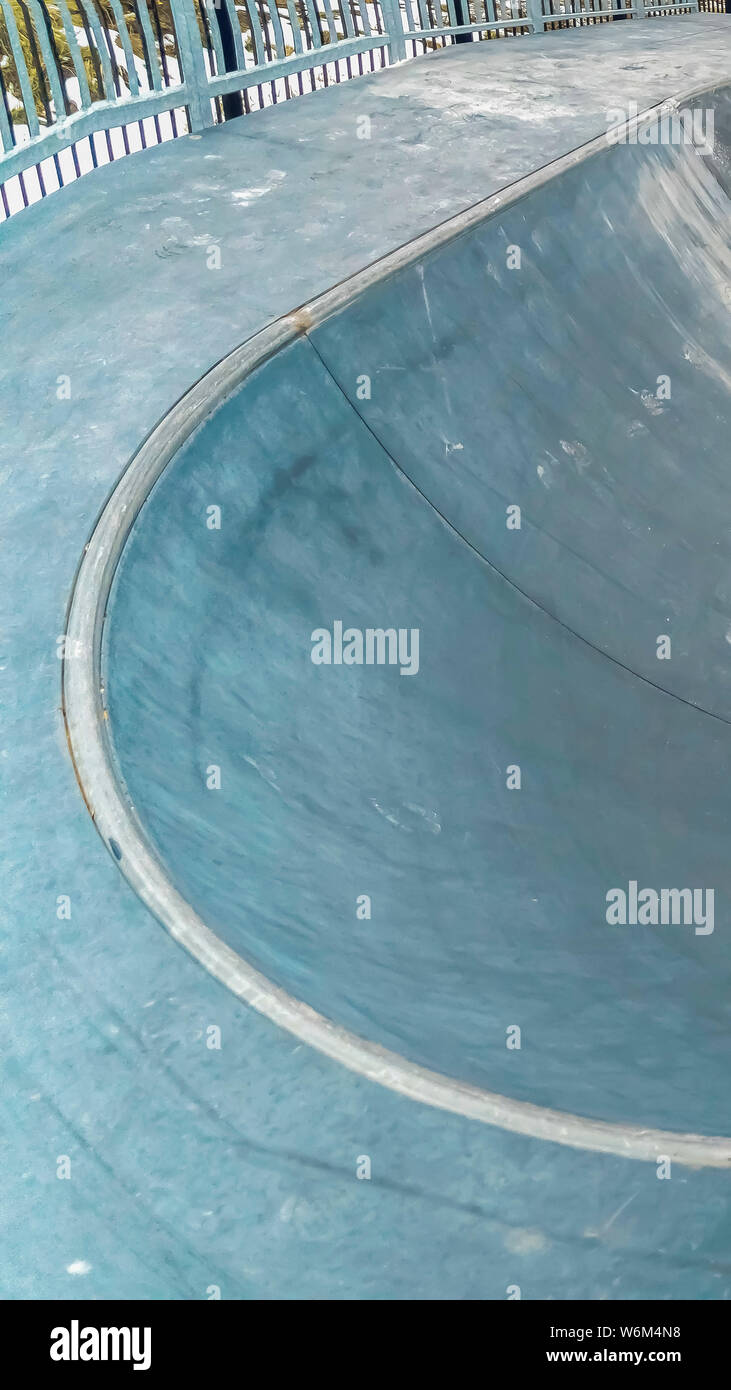 Vertical frame Conctere skate park with close view of the bowl shaped ...