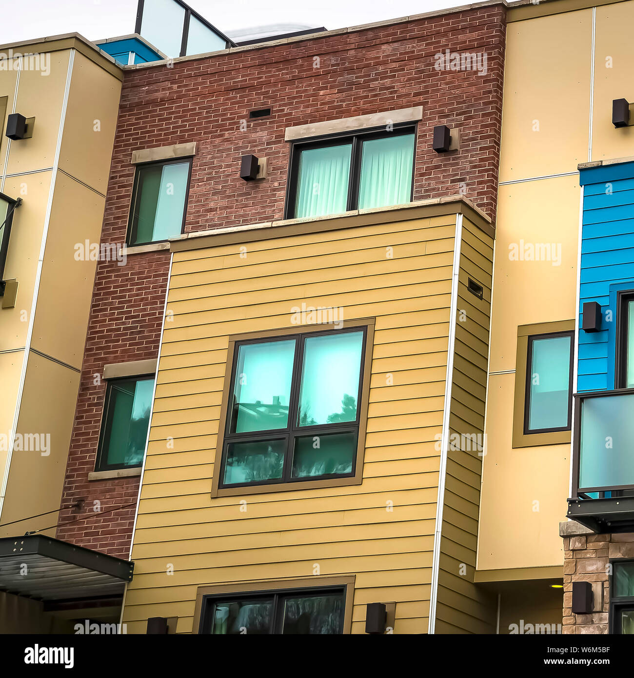 Square frame Residential building with horizontal siding concrete and ...
