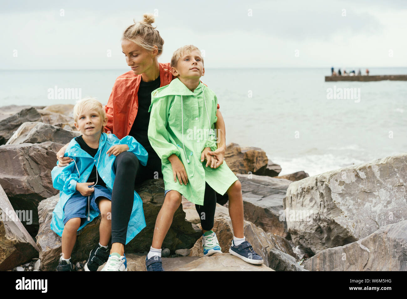 In raincoats hi-res stock photography and images - Alamy