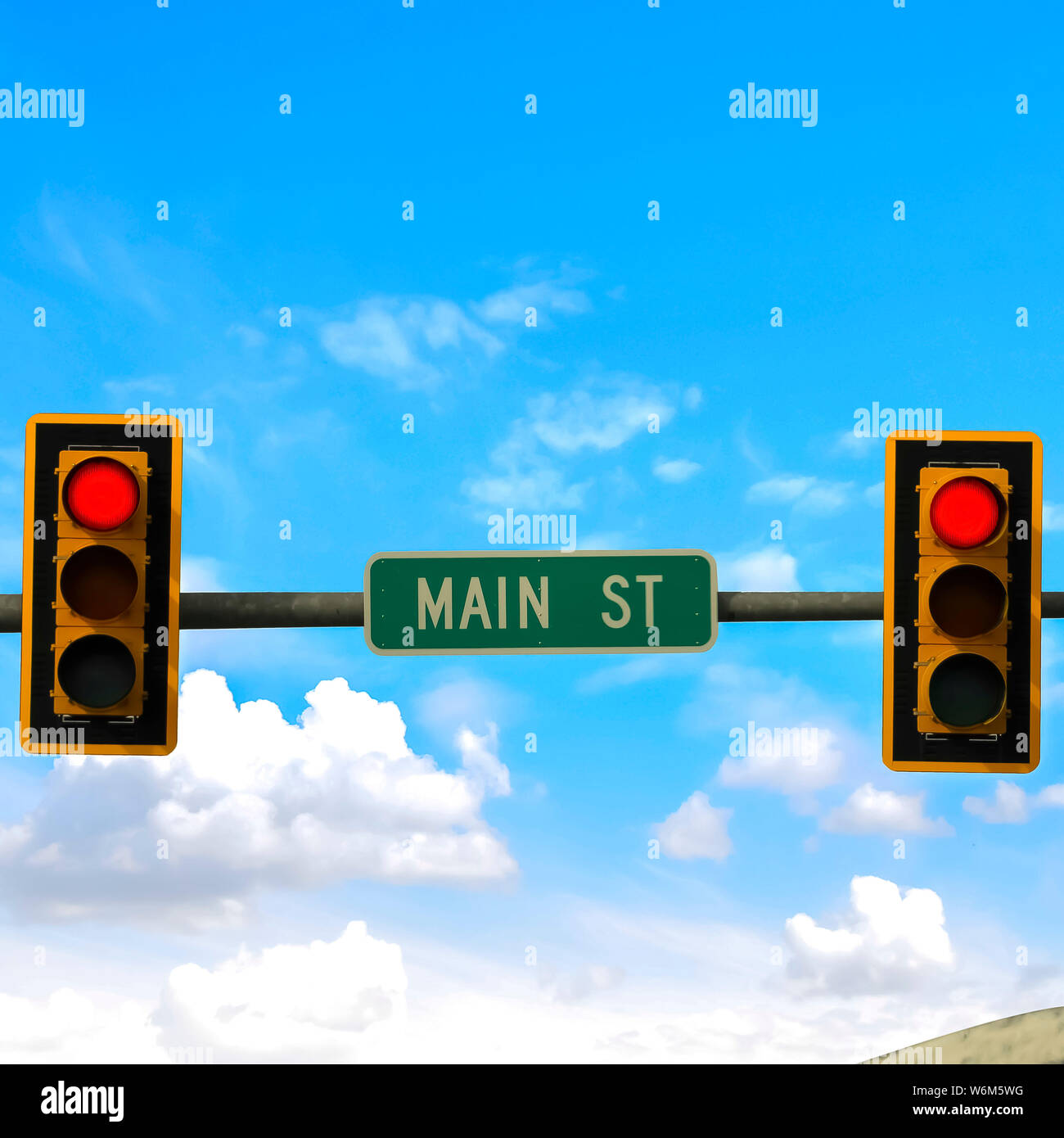 Square frame Main street sign between traffic lights mounted on a metal ...