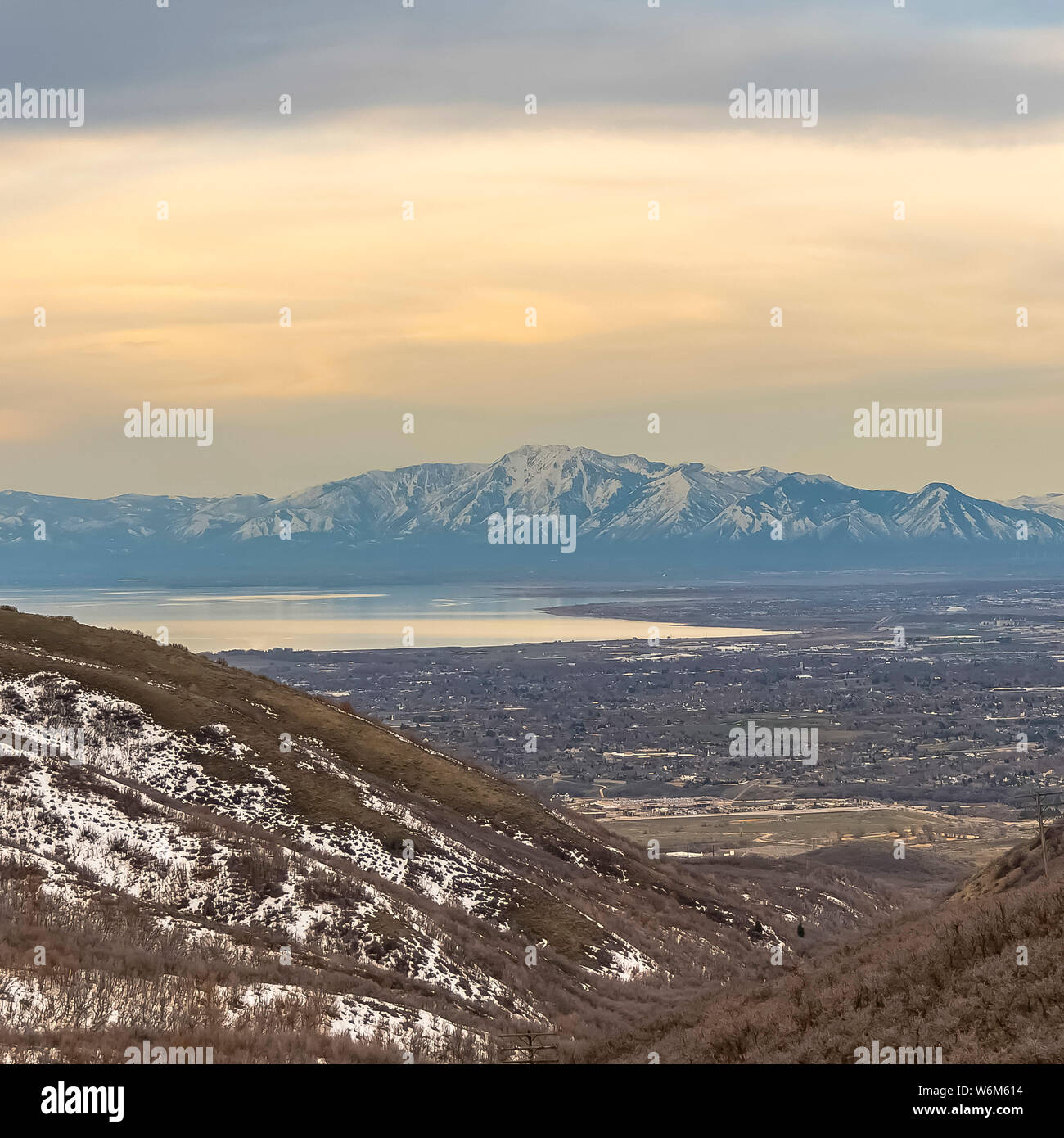 Square Lake and vast valley viewed from a mountain with trees and snow ...