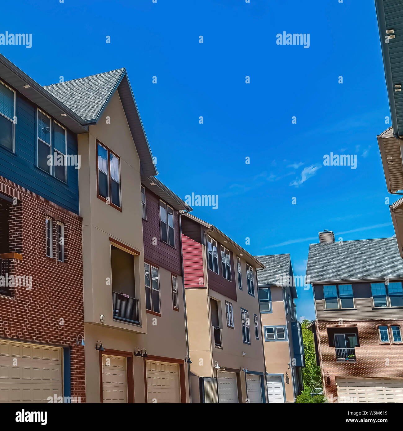 Square frame Exterior of homes with wooden and red brick wall against ...