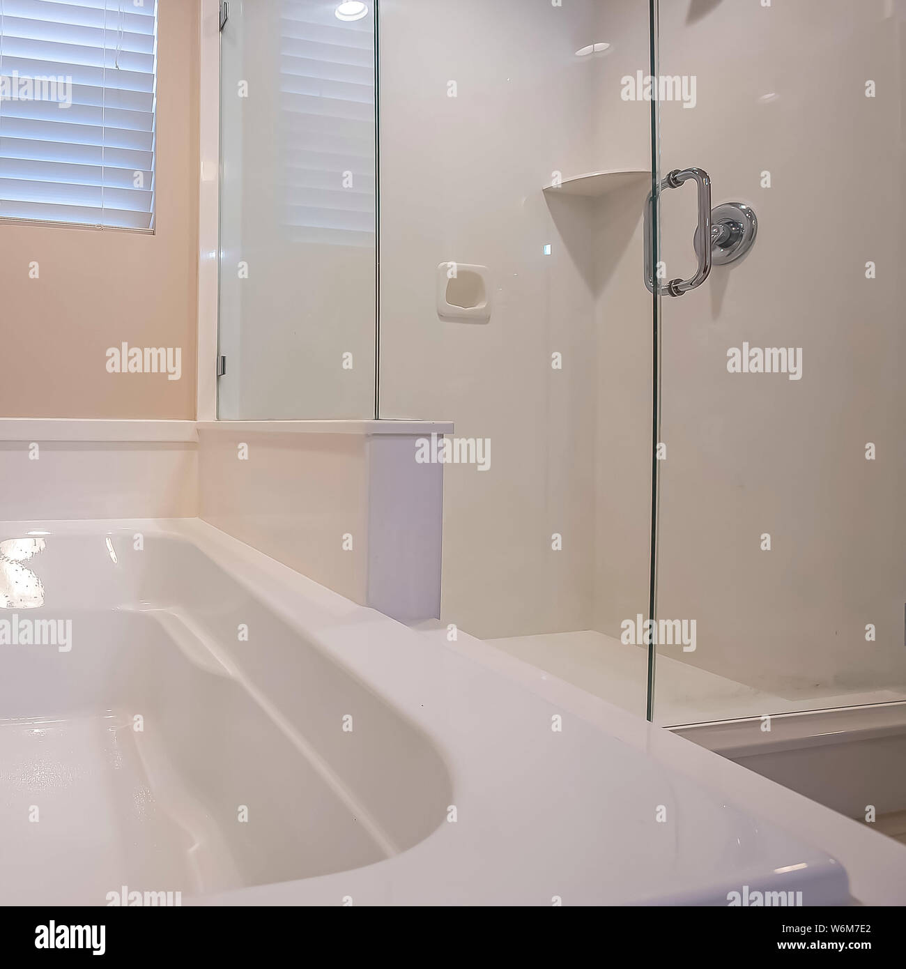 Square frame Bathroom interior of a home with shiny bathtub and glass ...