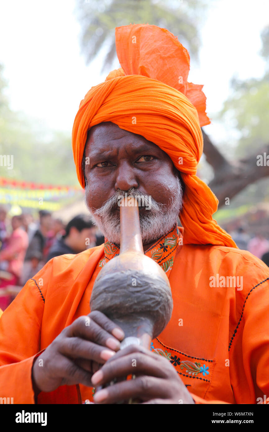 Snake charmer playing pungi at Surajkund Crafts Mela, Surajkund ...
