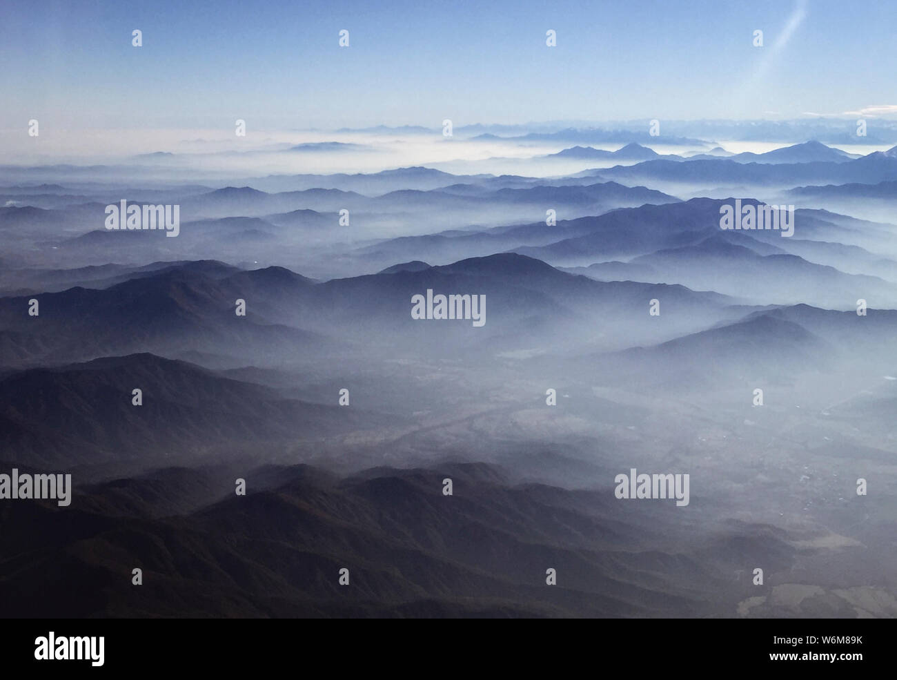 Clouds linger over hills stretching into distance, as photographed from ...
