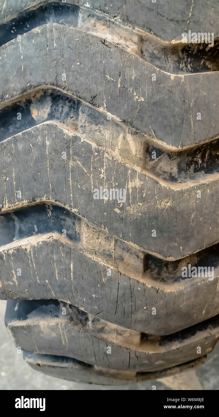 Vertical frame Details of the thick and heavy duty wheel of a yellow ...