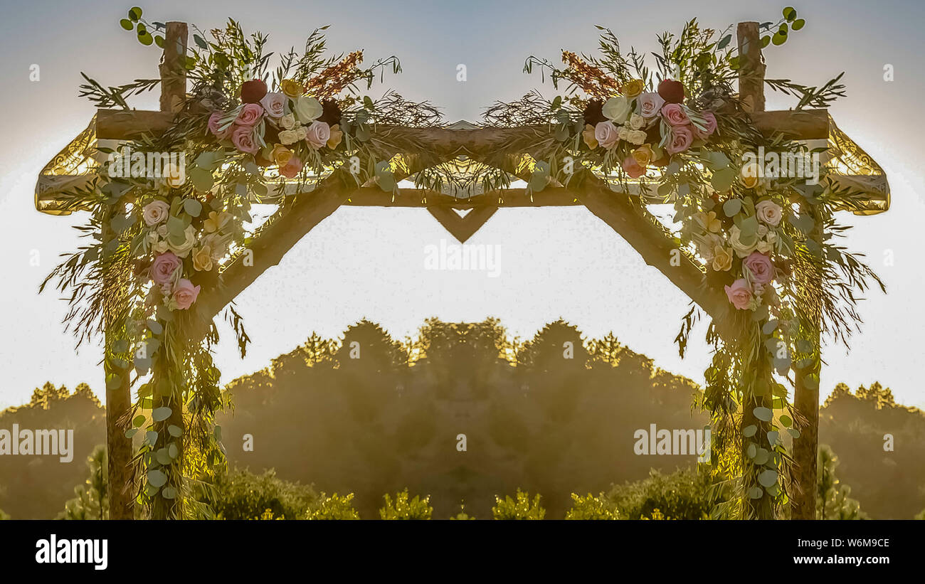 Panorama frame Flowers of a Chuppah at sunset on grass Stock Photo - Alamy