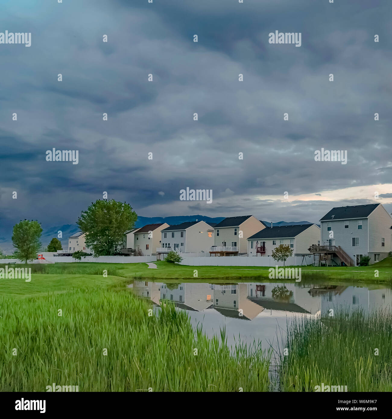 Square frame Overcast sky over a scenic neighborhood with lovely family ...