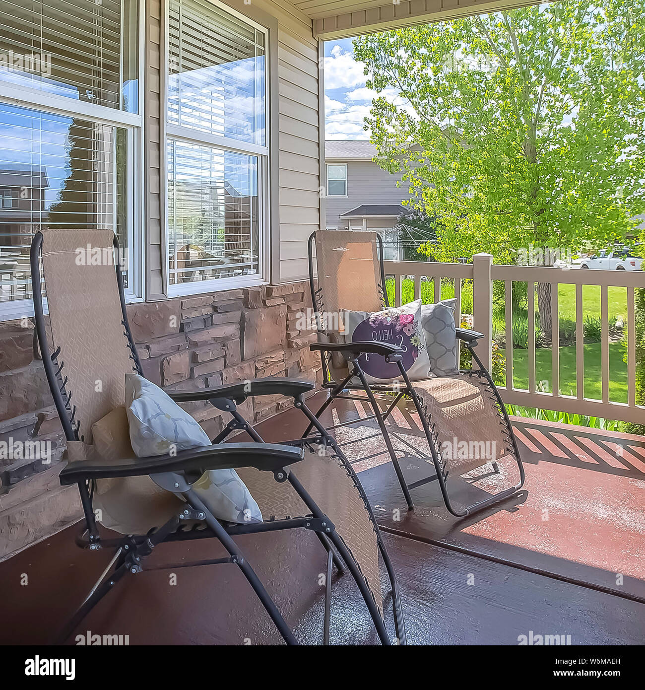 Square frame Relaxing seats on the porch of a home with view of the ...
