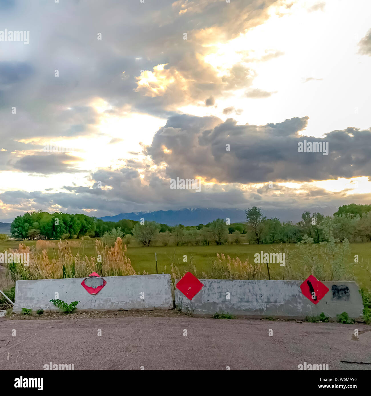 Square Road with traffic delineator posts and concrete road blocks ...