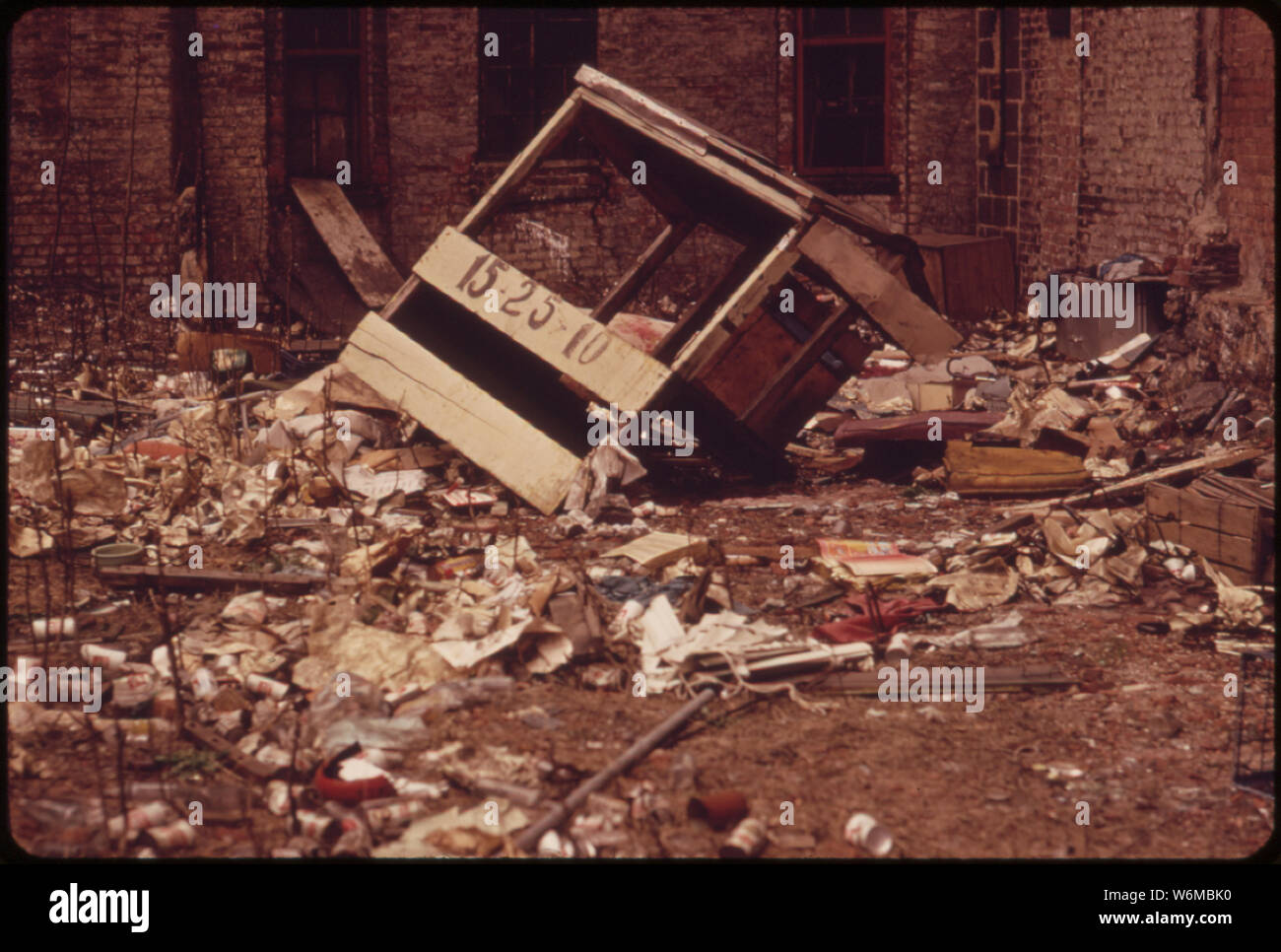 TRASH-FILLED LOT BEHIND APARTMENT HOUSE ON UPPER LEXINGTON AVENUE AT ...
