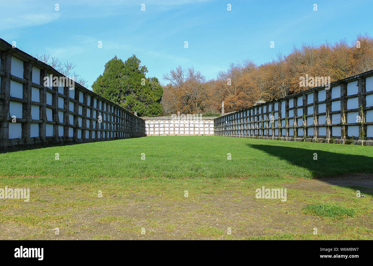 vertical cemetery with grass and blue sky Stock Photo - Alamy