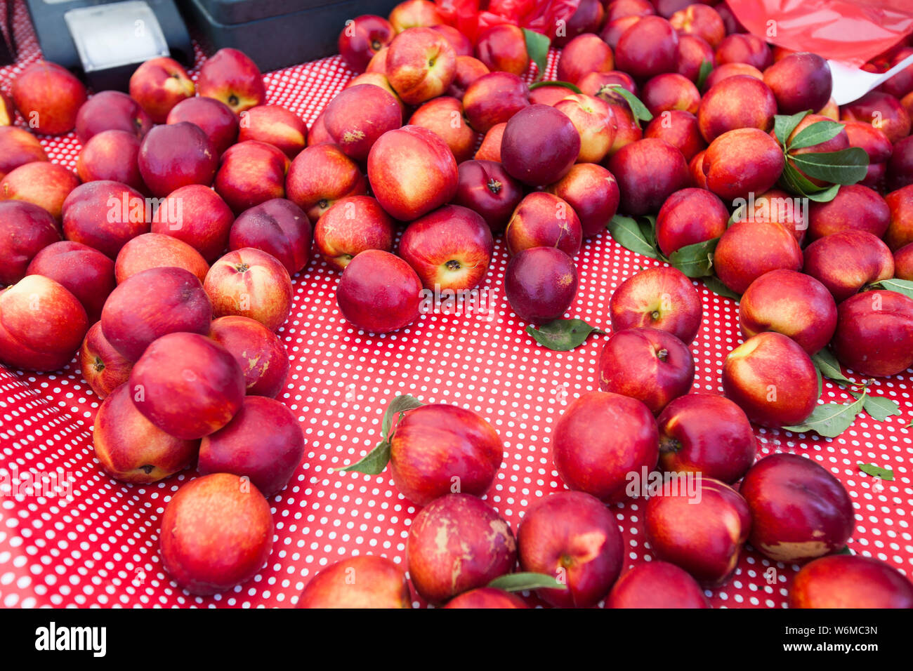 A bunch of fresh nectarine on the local farmers market Stock Photo - Alamy