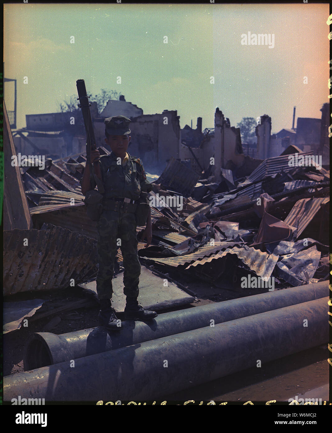 Tan Son Nhut, Vietnam. This twelve year old ARVN Airborne trooper with ...