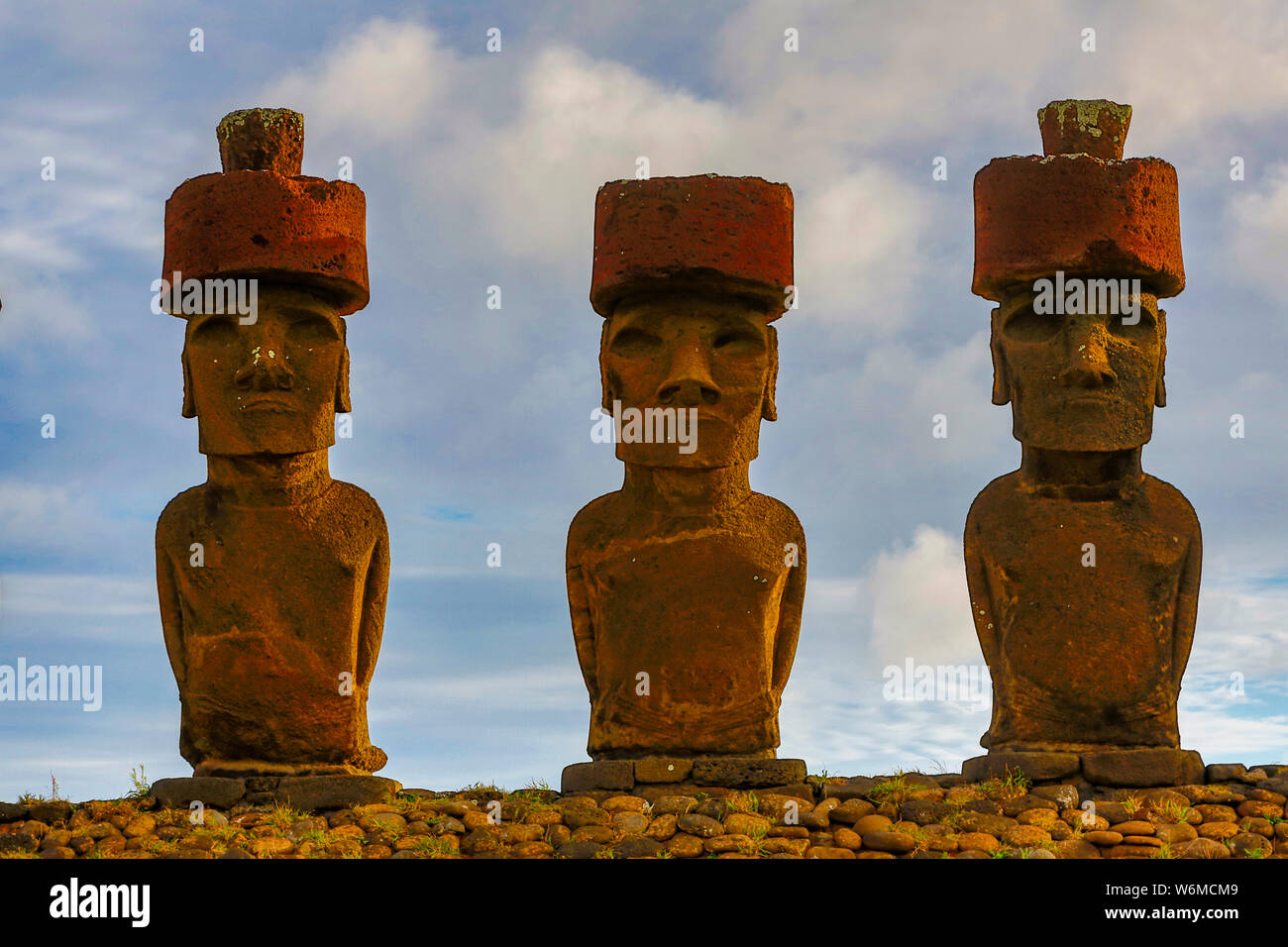 Moai on Easter Island with red topknot hats at Anakena Ahu Stock Photo ...