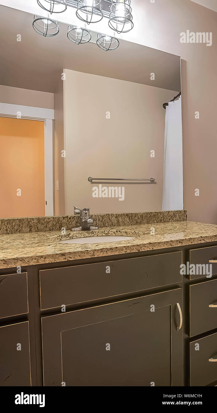 Vertical Vanity unit toilet and towel hook against the white wall of a ...