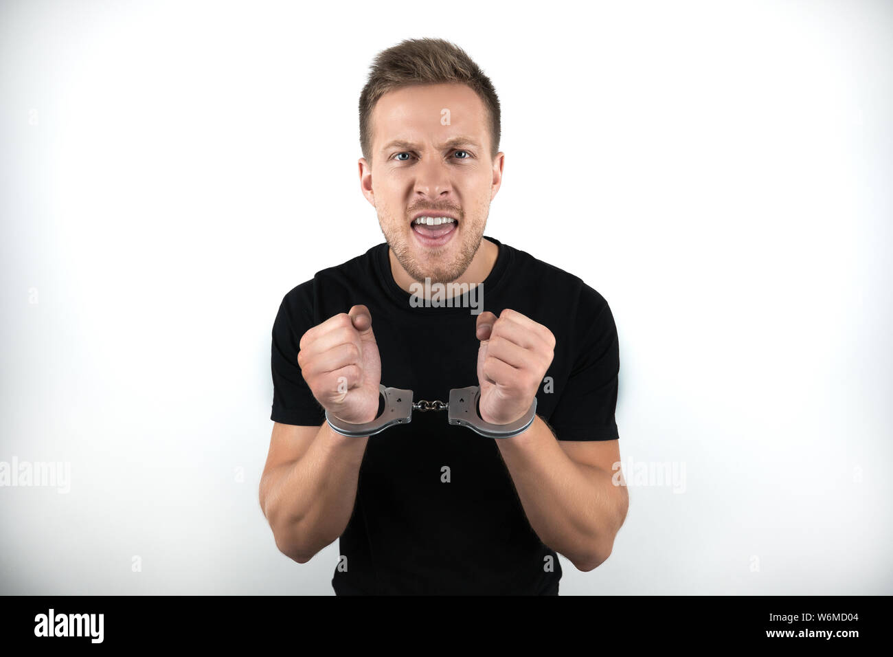 Handcuffed young man hi-res stock photography and images - Alamy