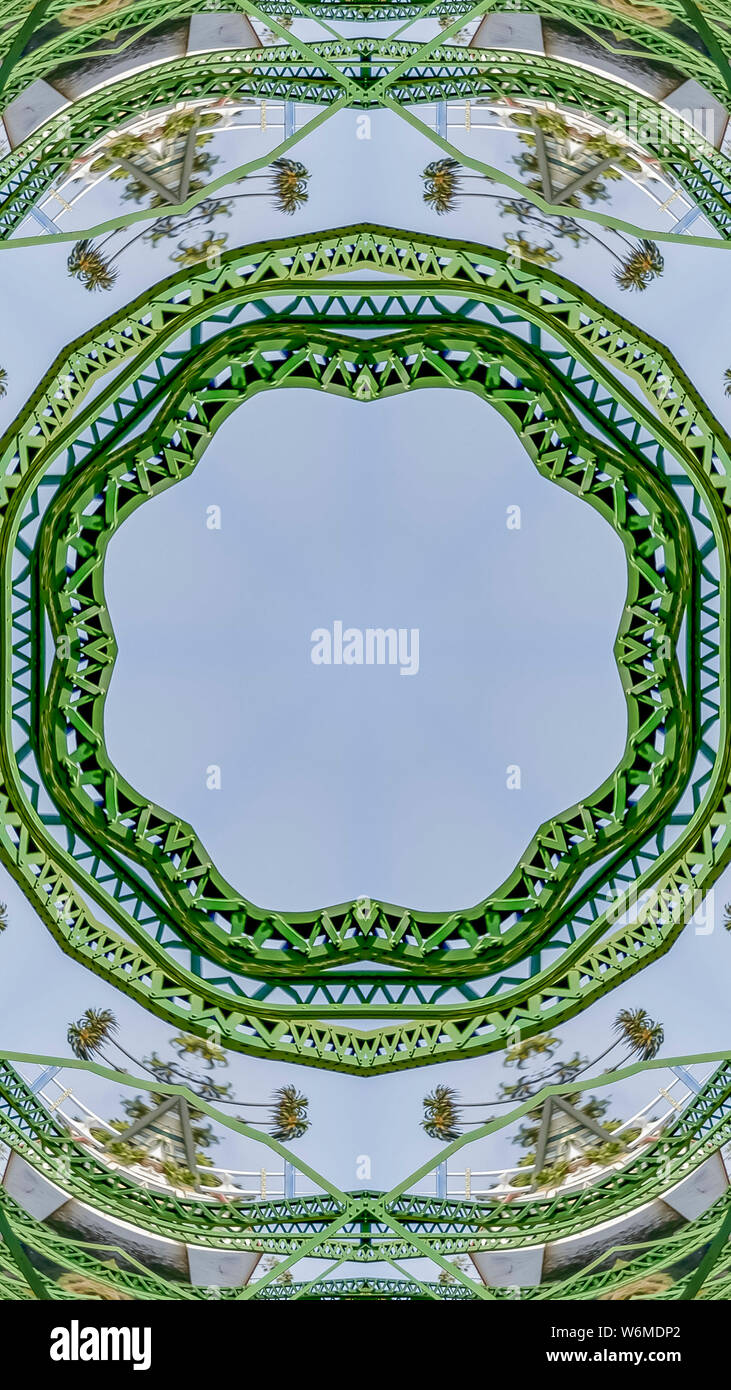 Vertical Circular green metal bars created using reflections in a ...