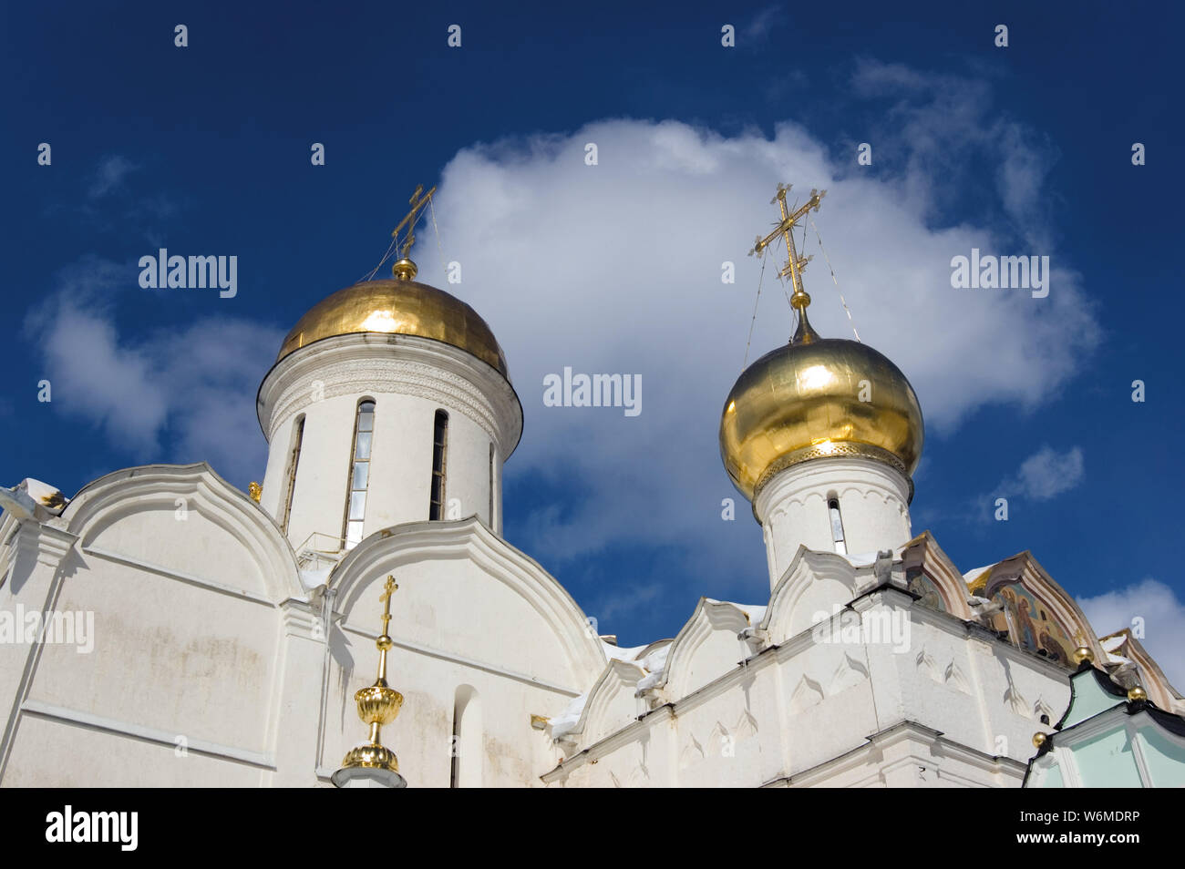 Colden cupola of Russian church against blue sky. Troitskiy Cathedral ...