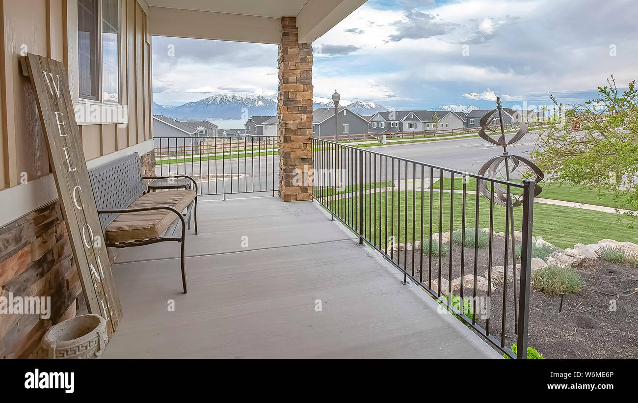 Panorama Porch overlooking yard road homes lake and mountain under ...