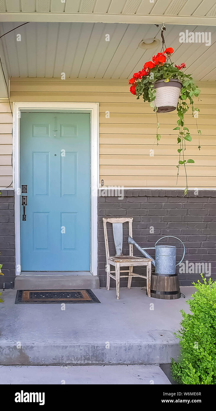 Vertical Exterior view of a home with stepas and porch in front of the ...